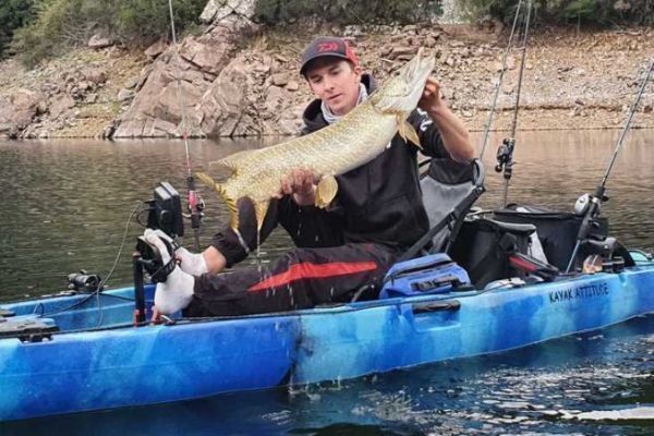Fishing for carnivorous fish in kayak in Corsica, on the Tolla lake